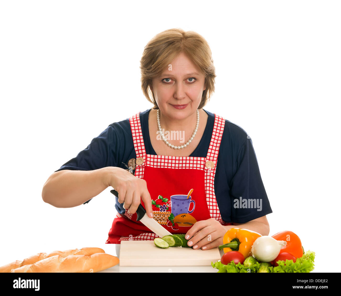 Elderly woman cooks food Stock Photo - Alamy