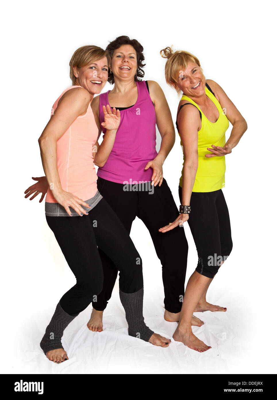 Three cute woman dancing on isolated white background Stock Photo - Alamy