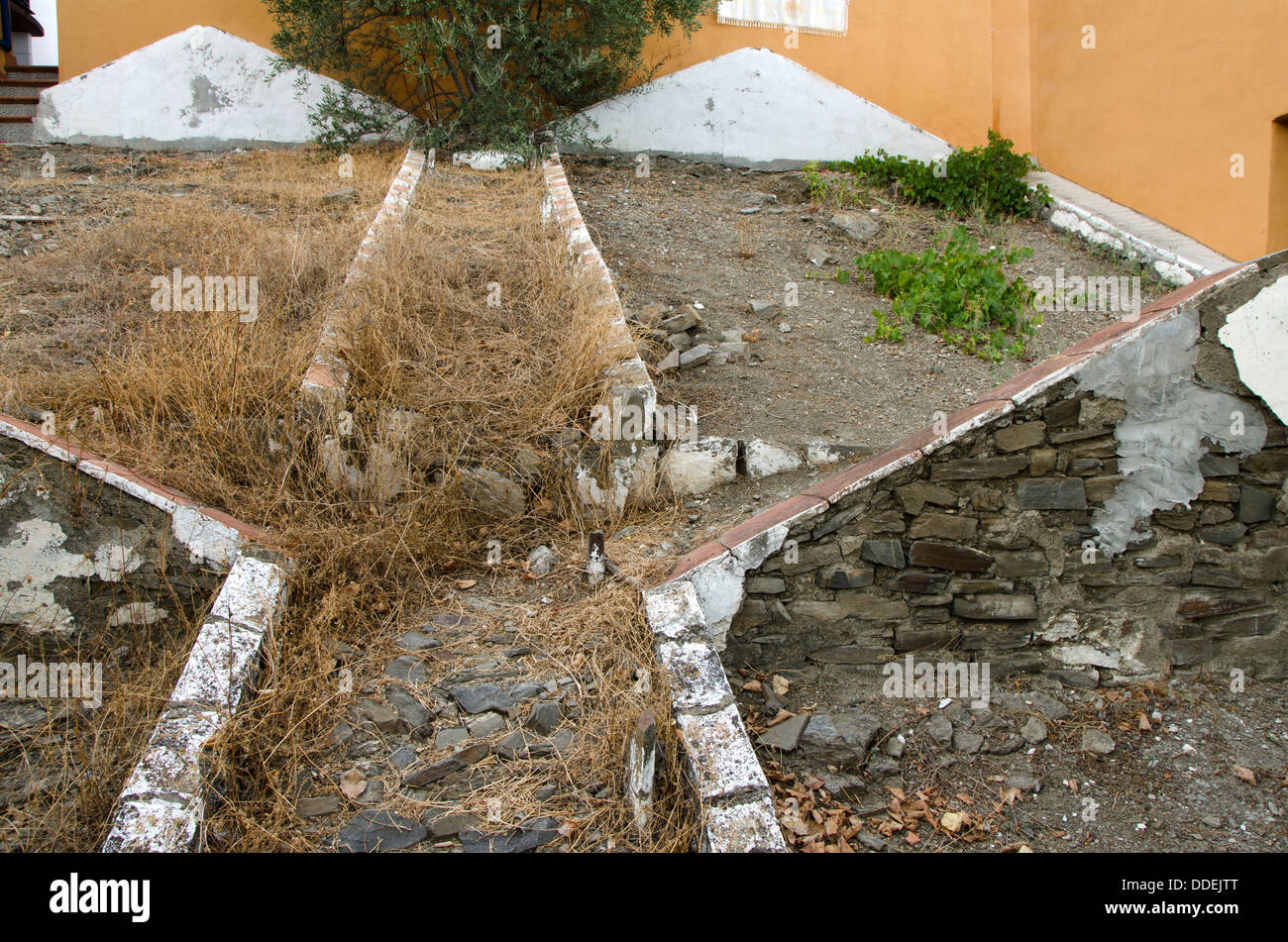 Old beds for sun-drying the hand picked grapes to produce raisins in ...