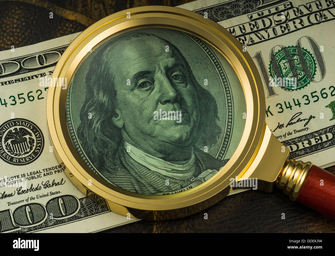 Usa dollars viewed through a magnifying glass Stock Photo - Alamy