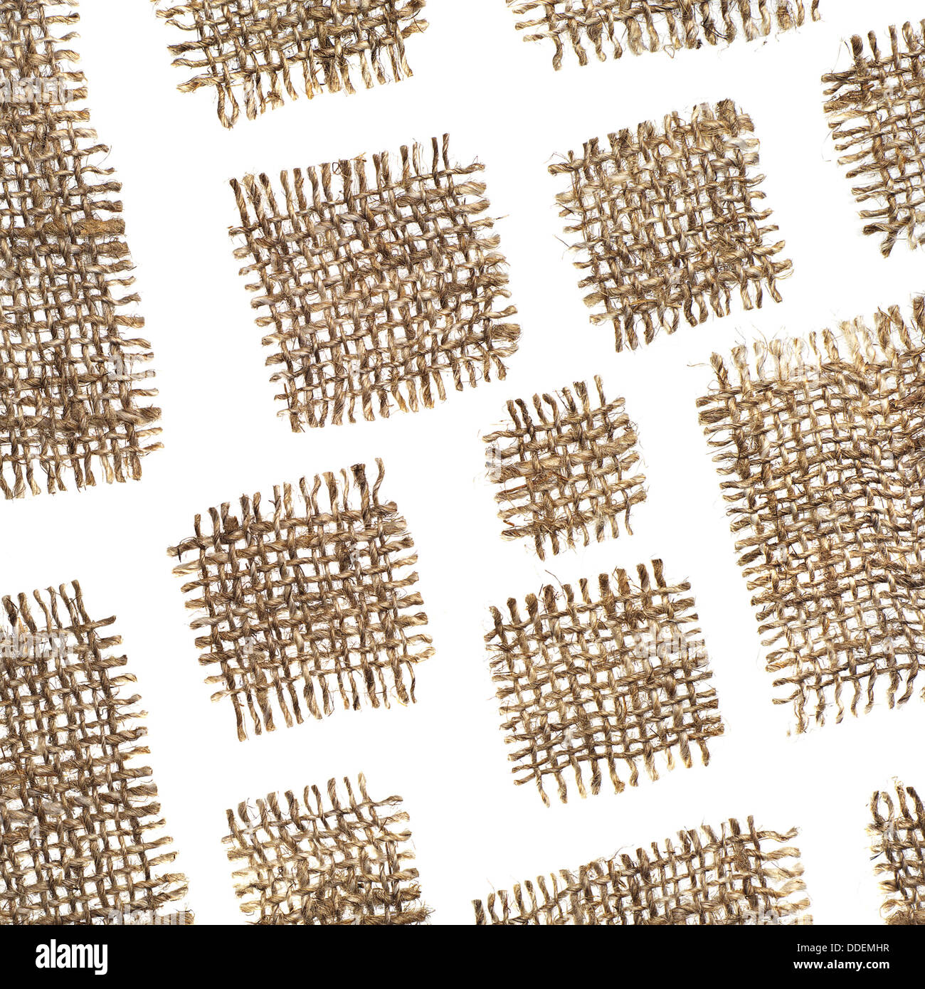 Background from pieces of coarse fabric isolated on white Stock Photo ...