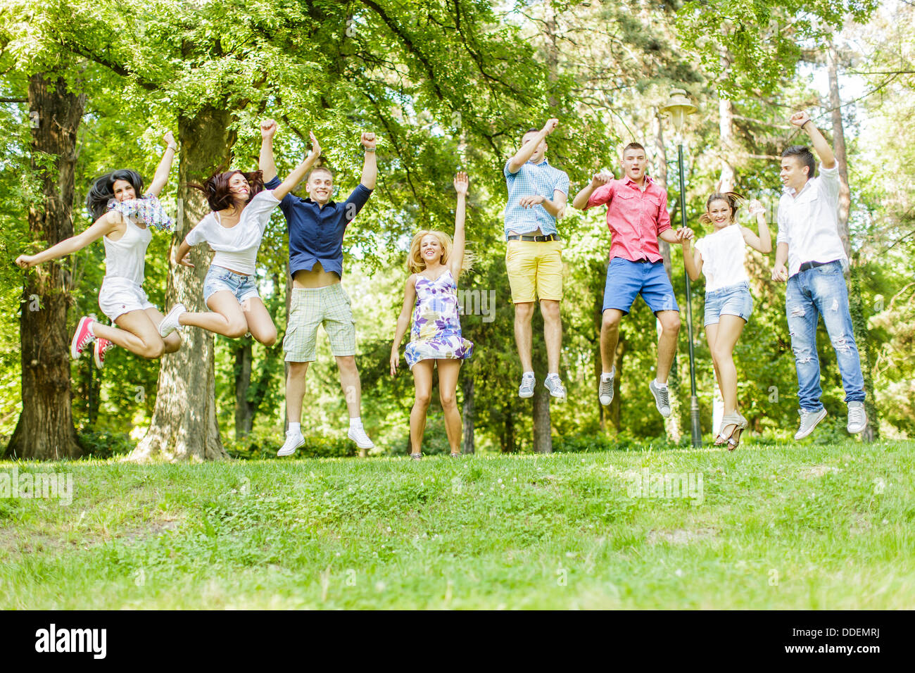 Teenagers jumps in the park Stock Photo - Alamy
