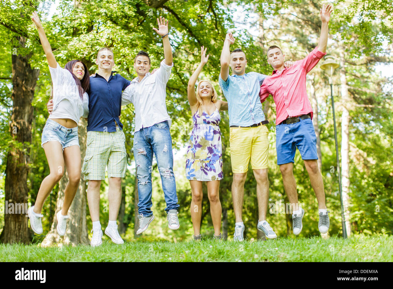 Teenagers jumps in the park Stock Photo - Alamy