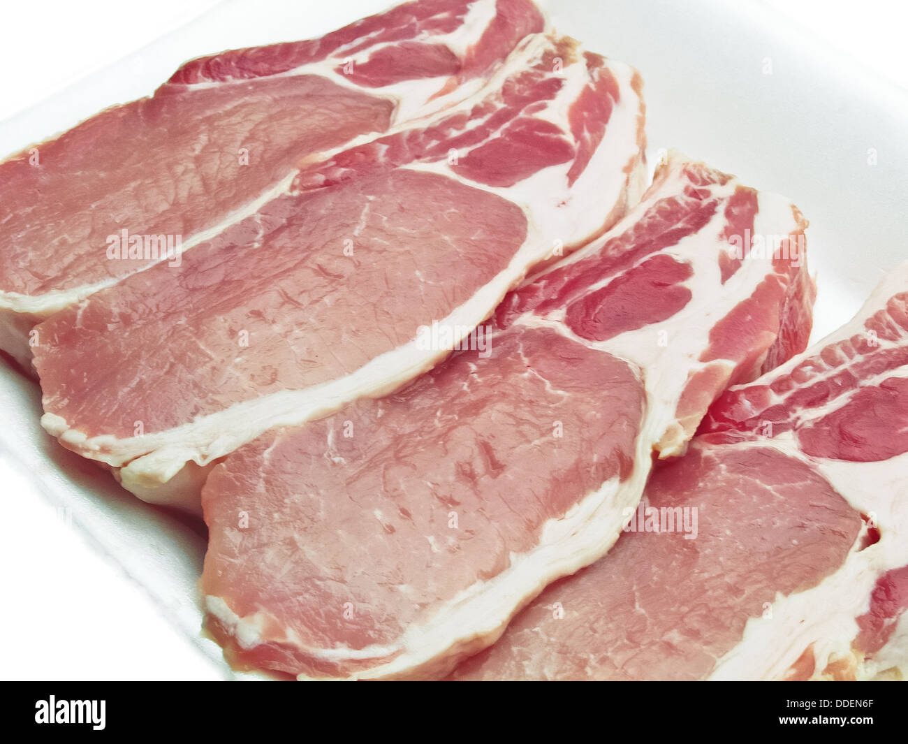 Pork chops packed in a container Stock Photo - Alamy