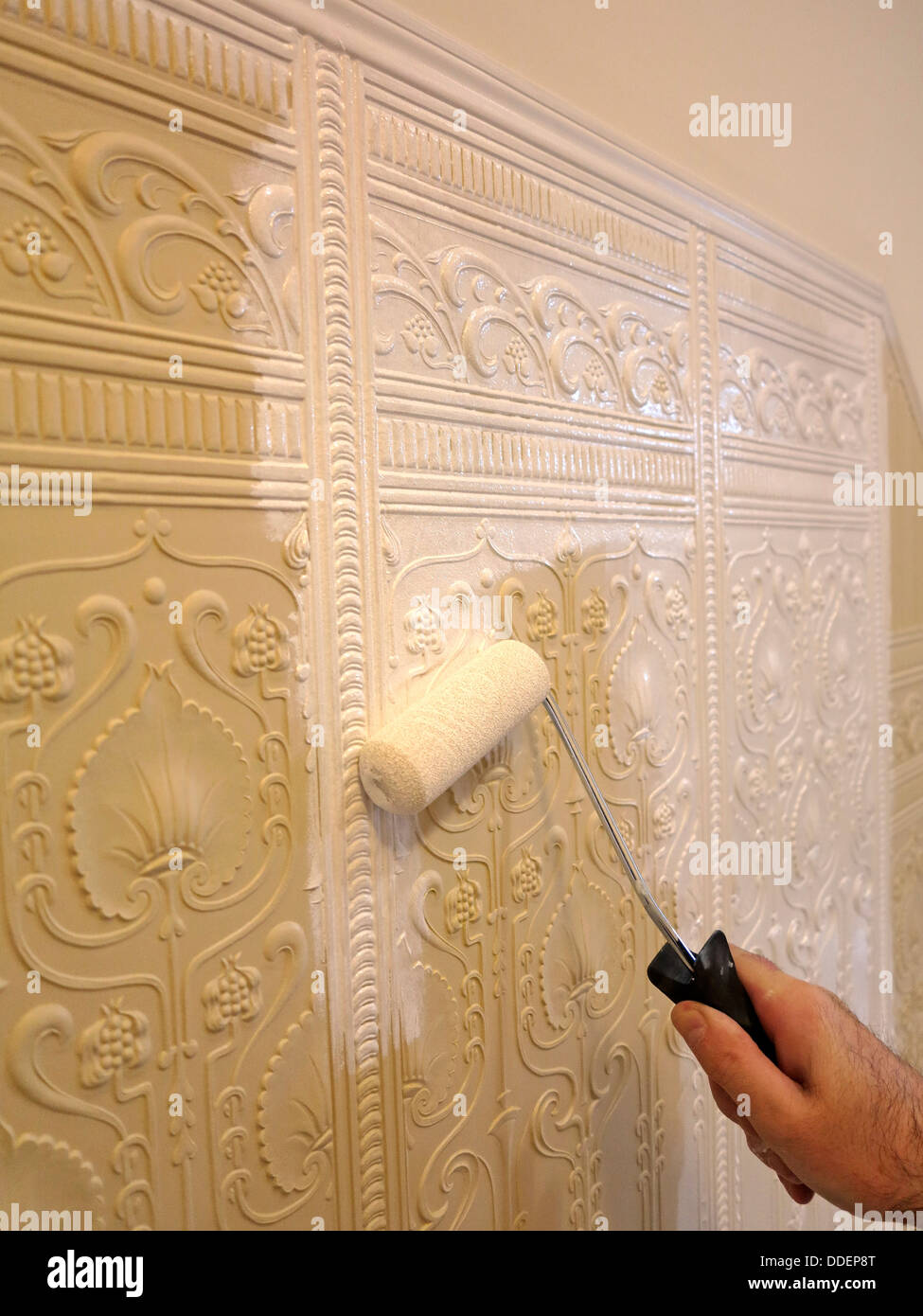 Traditional decorating, painter and decorator painting newly hung ...