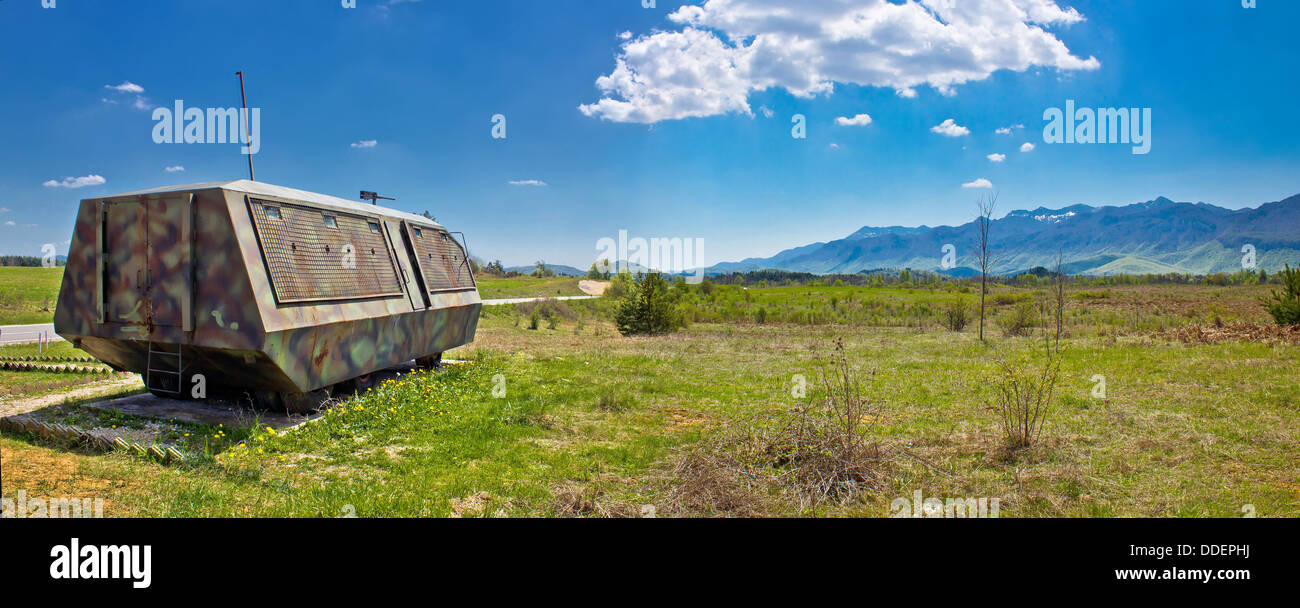 Lika nature scenery and armoured military vehicle, Velebit mountain ...