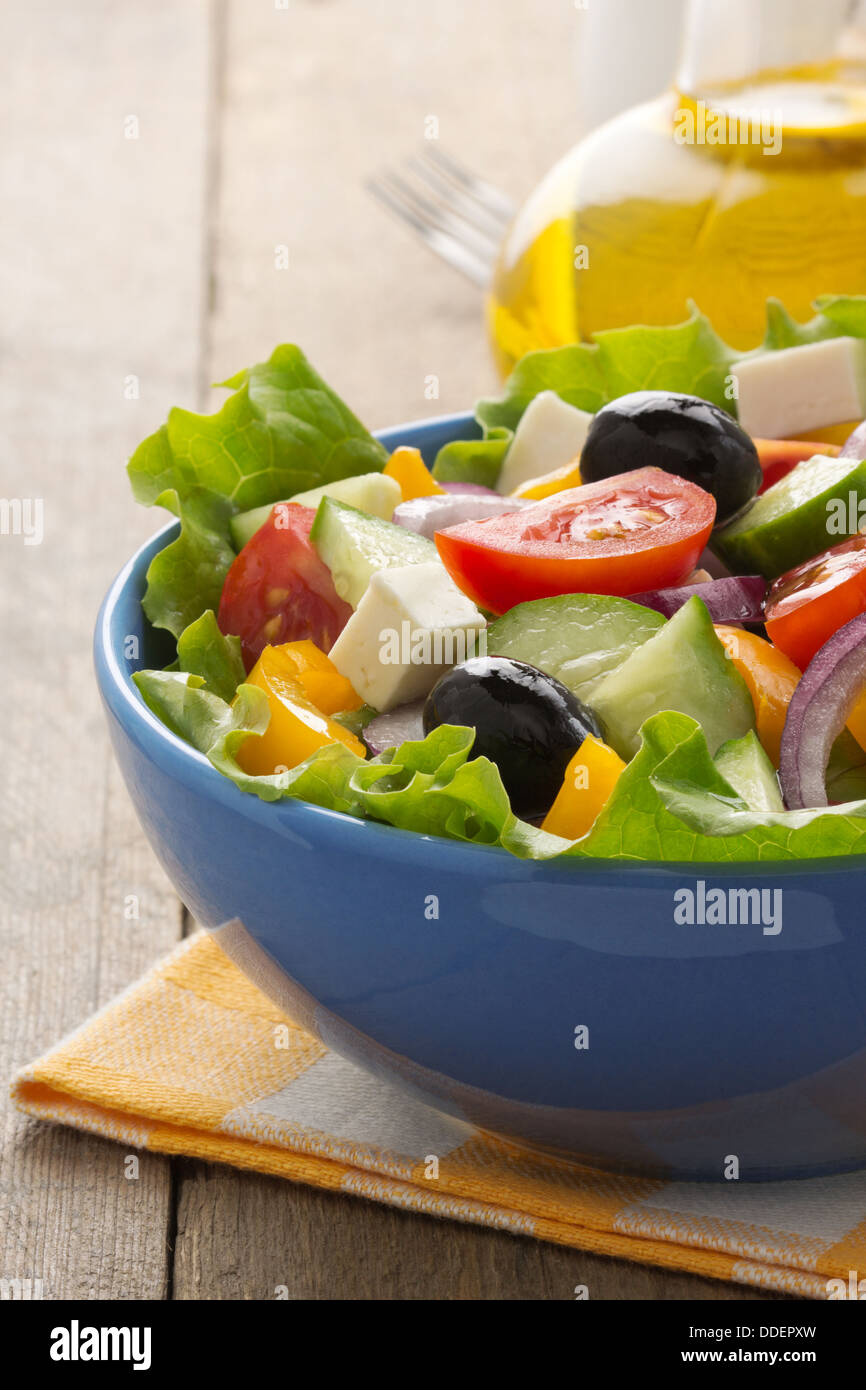 greek salad on wood background Stock Photo - Alamy