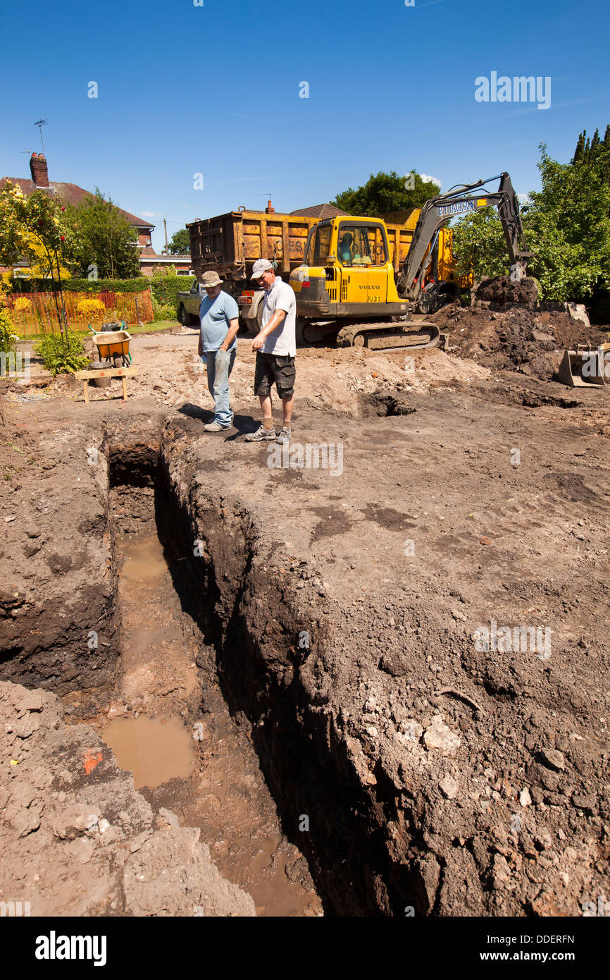 Construction worker inspecting ground in hi-res stock photography and ...