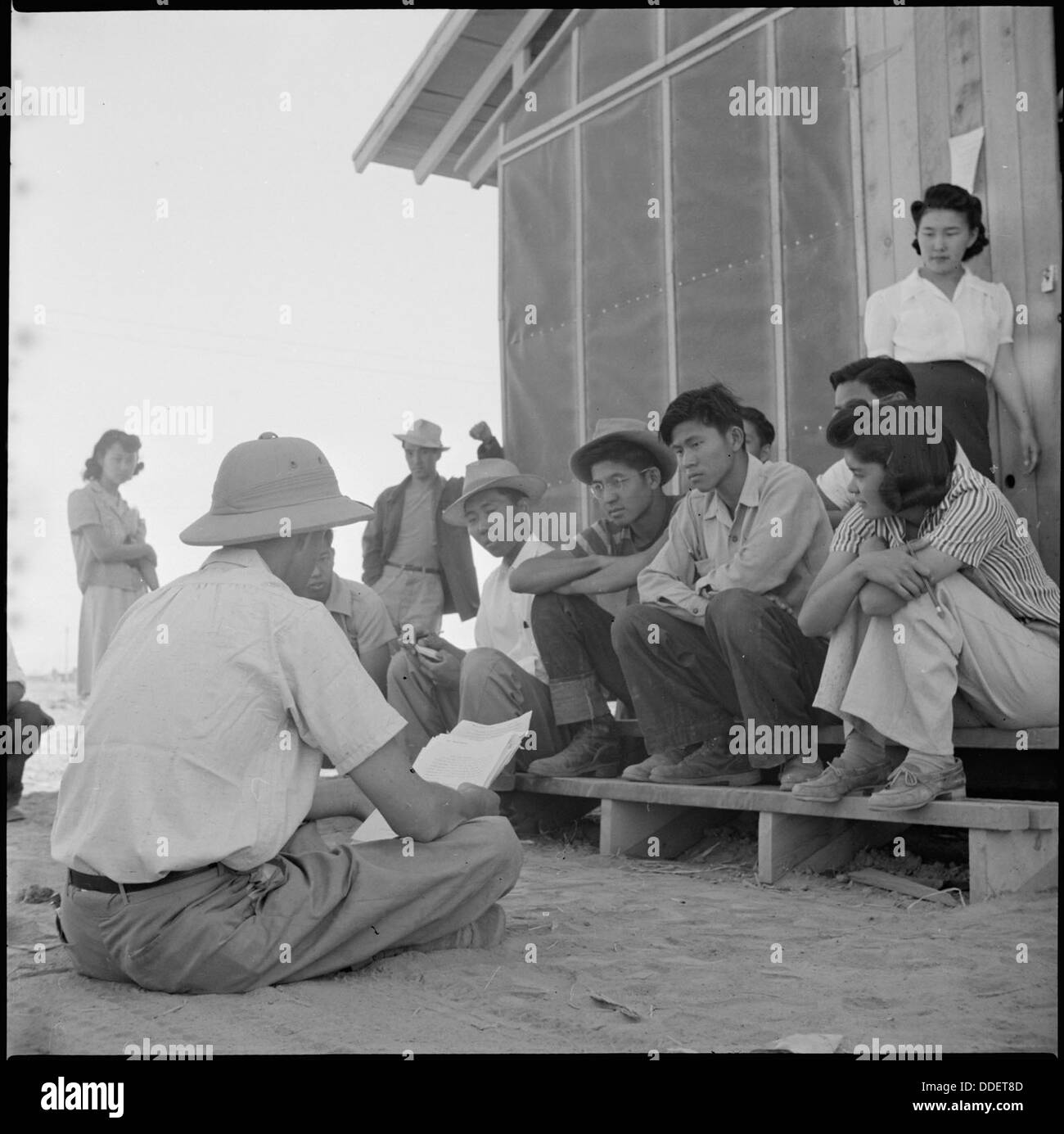 Norris James, a War Relocation Authority representative, gives ...