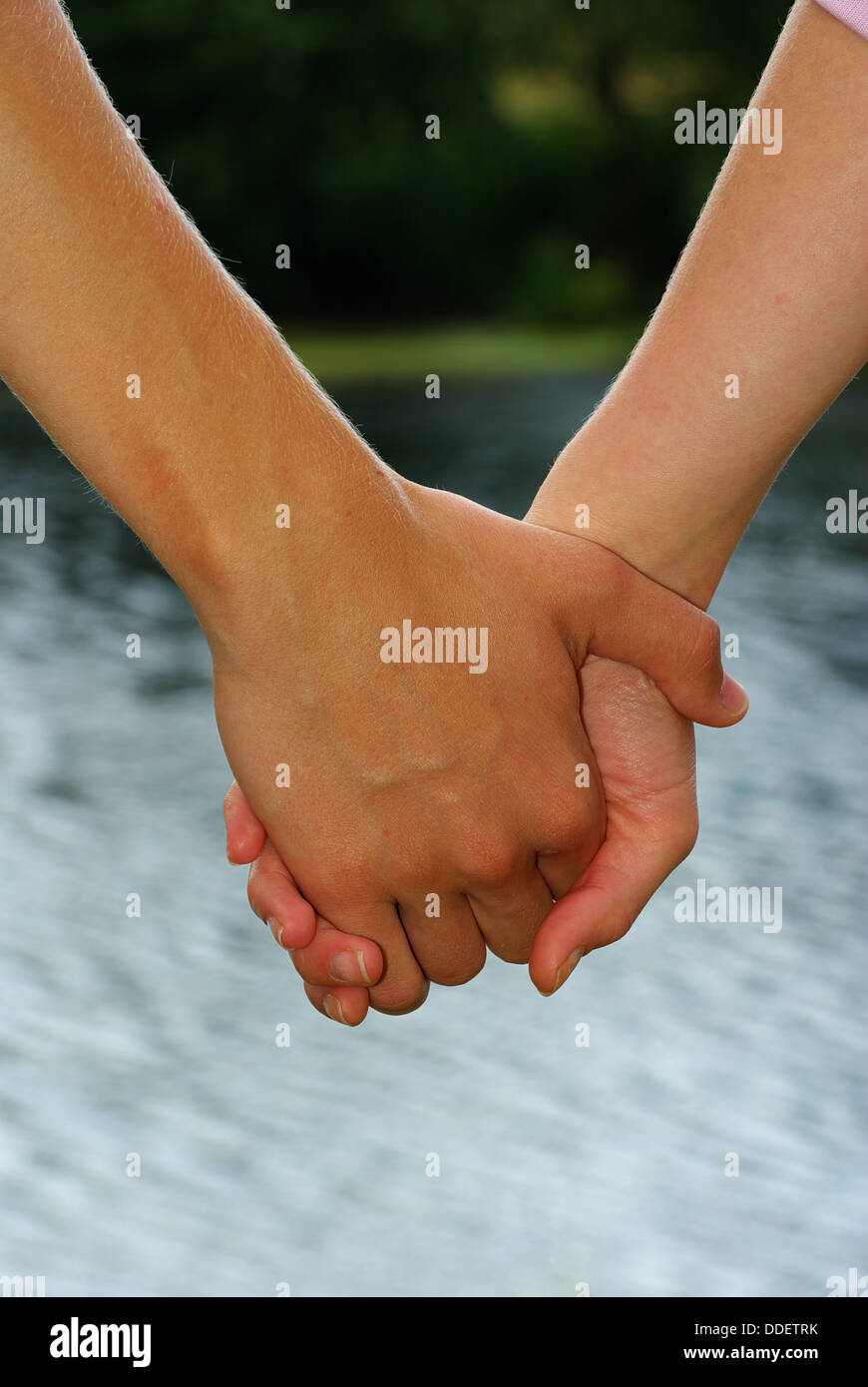 Hand in a hand Stock Photo - Alamy