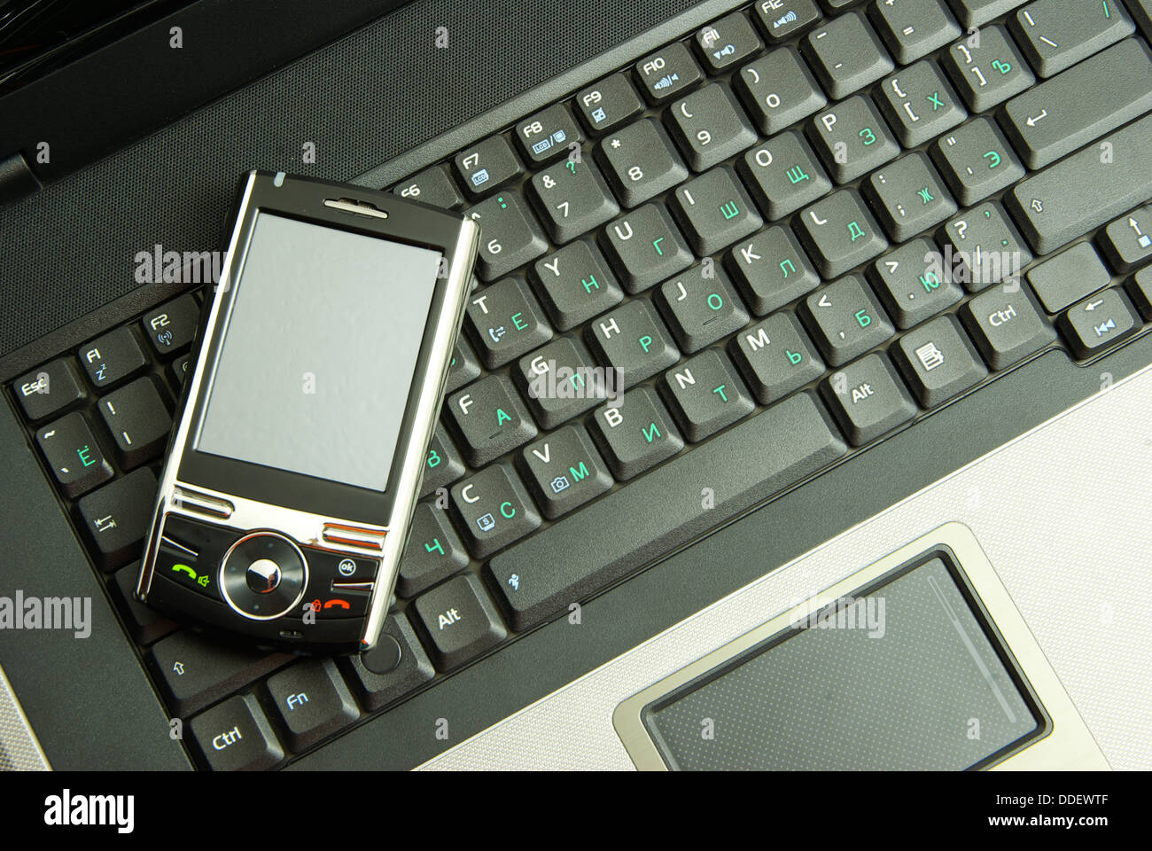 mobile on laptop Stock Photo - Alamy