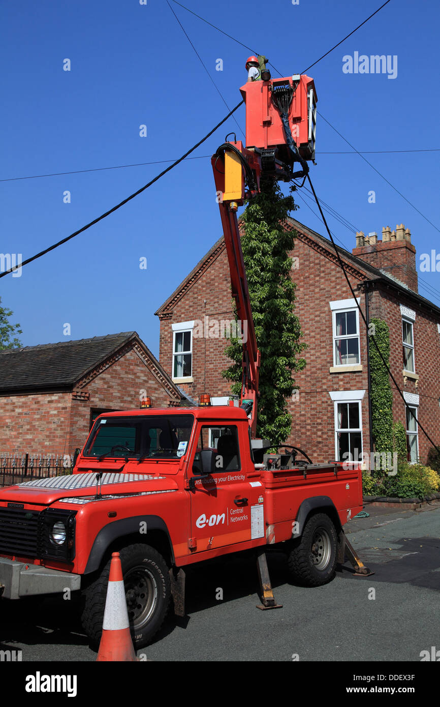 An employee of E.ON energy company upgrading the electricity network on ...