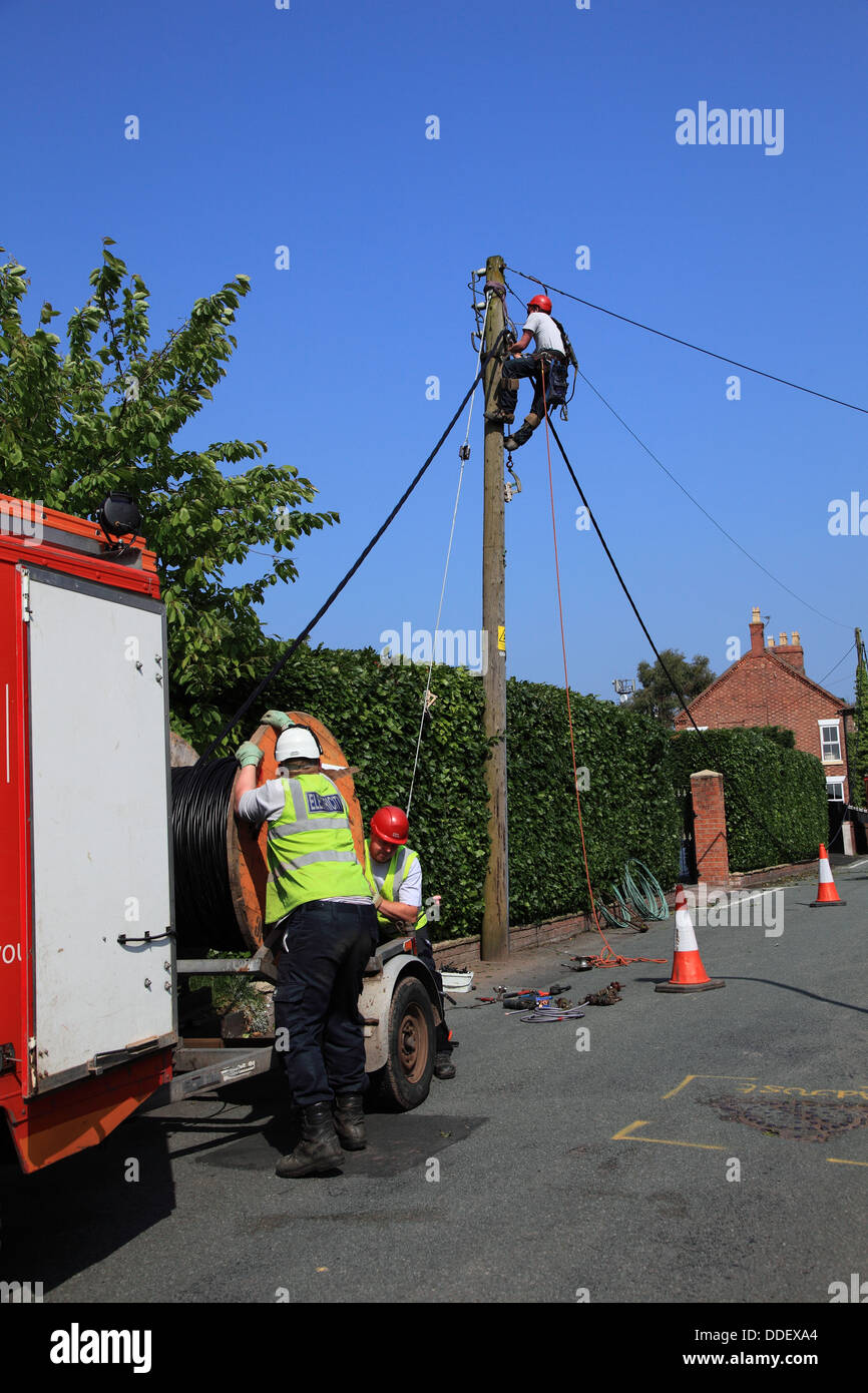 Employees of E.ON energy company upgrading the electricity network on ...