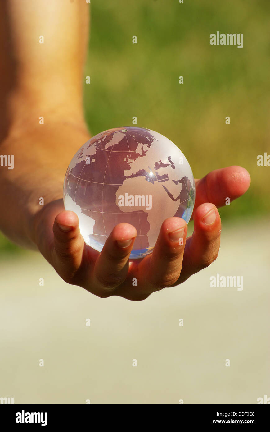 globe in hand Stock Photo - Alamy