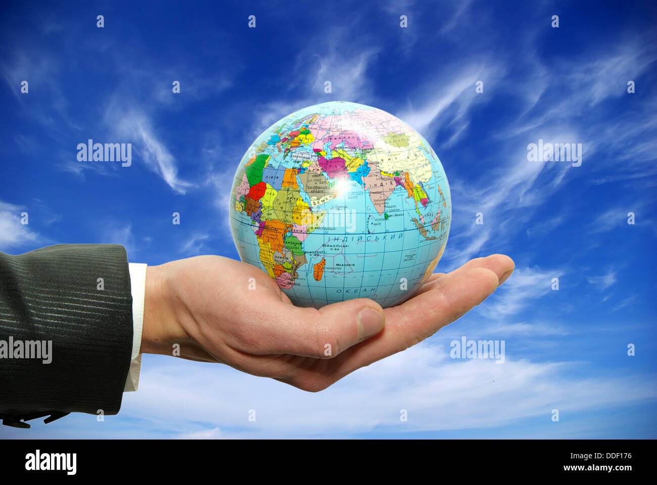 globe in hand Stock Photo - Alamy