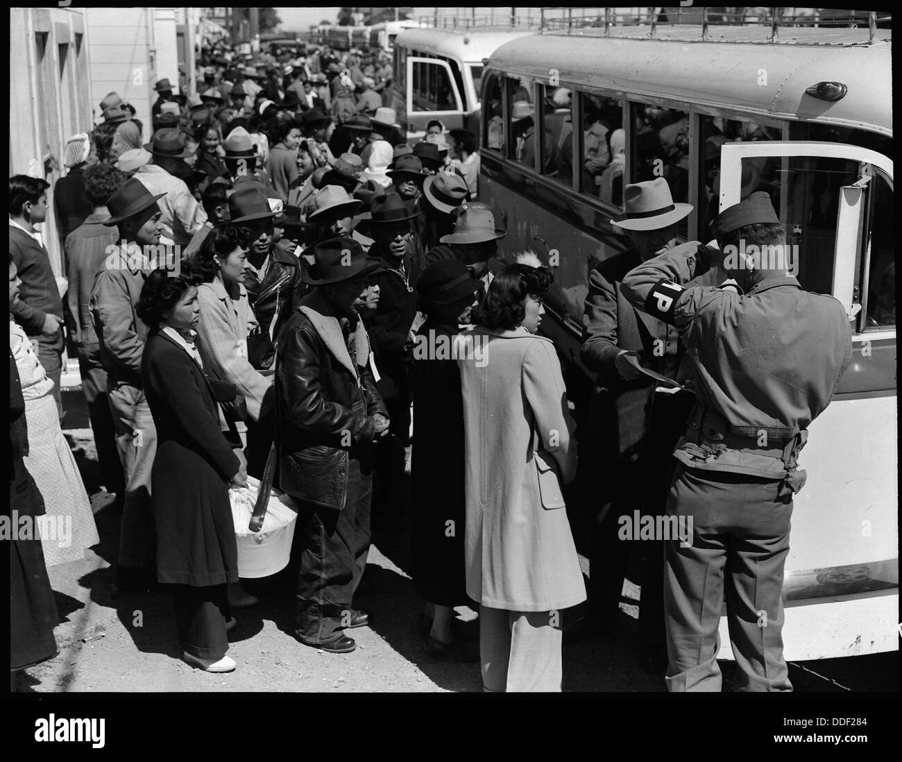 Farm families of Japanese ancestry in Byron, California, board buses ...