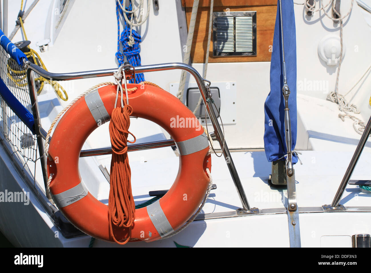 Orange lifebuoy attached to a boat at the port of Venice ready upon ...