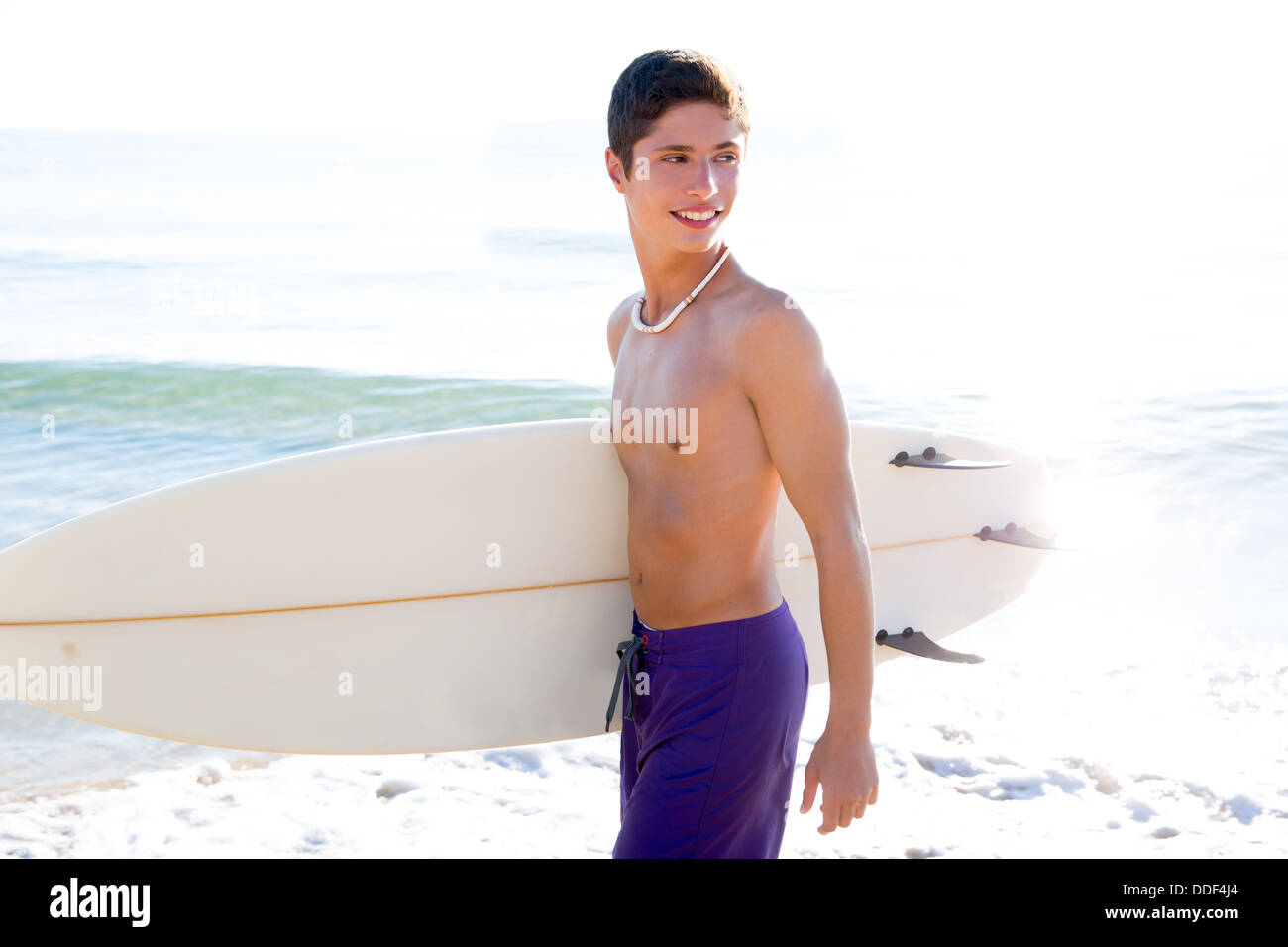 Surfer handsome boy teenager with surfboard in beach shore Stock Photo ...