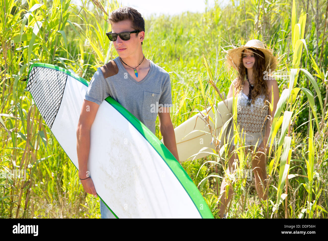 Boy and girl surfers hi-res stock photography and images - Alamy