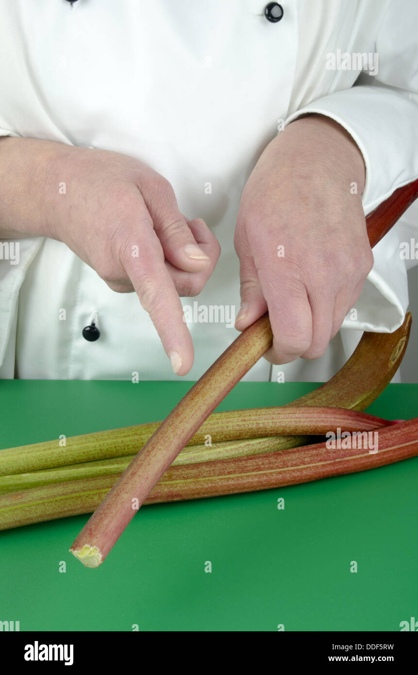 female chef shows with her index finger on rhubarb Stock Photo - Alamy