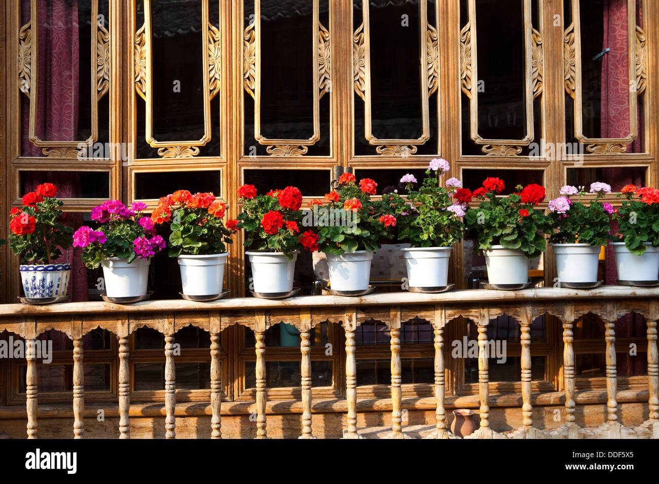 Flower pots in a row Stock Photo - Alamy