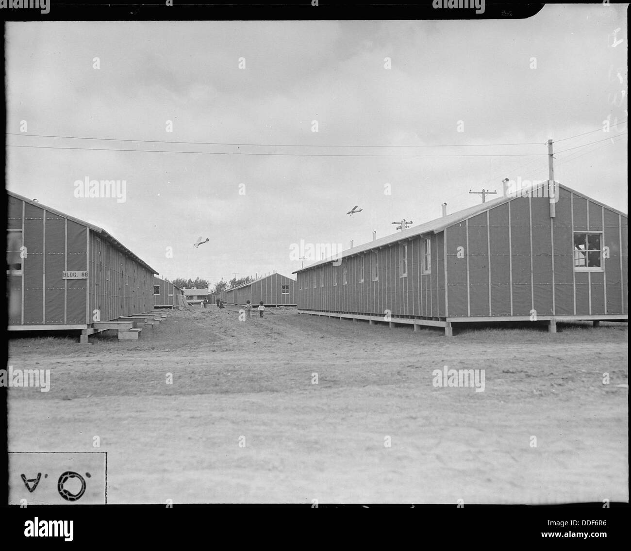The Salinas Assembly Center in California is depicted between two rows ...