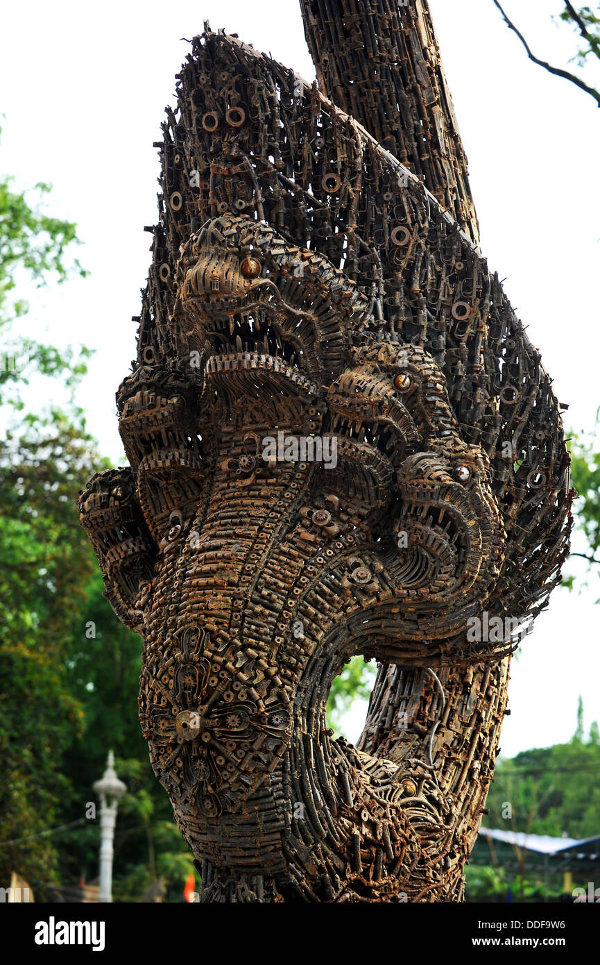 Naga or snake statue of peace. Made from thousands of old weapons and ...