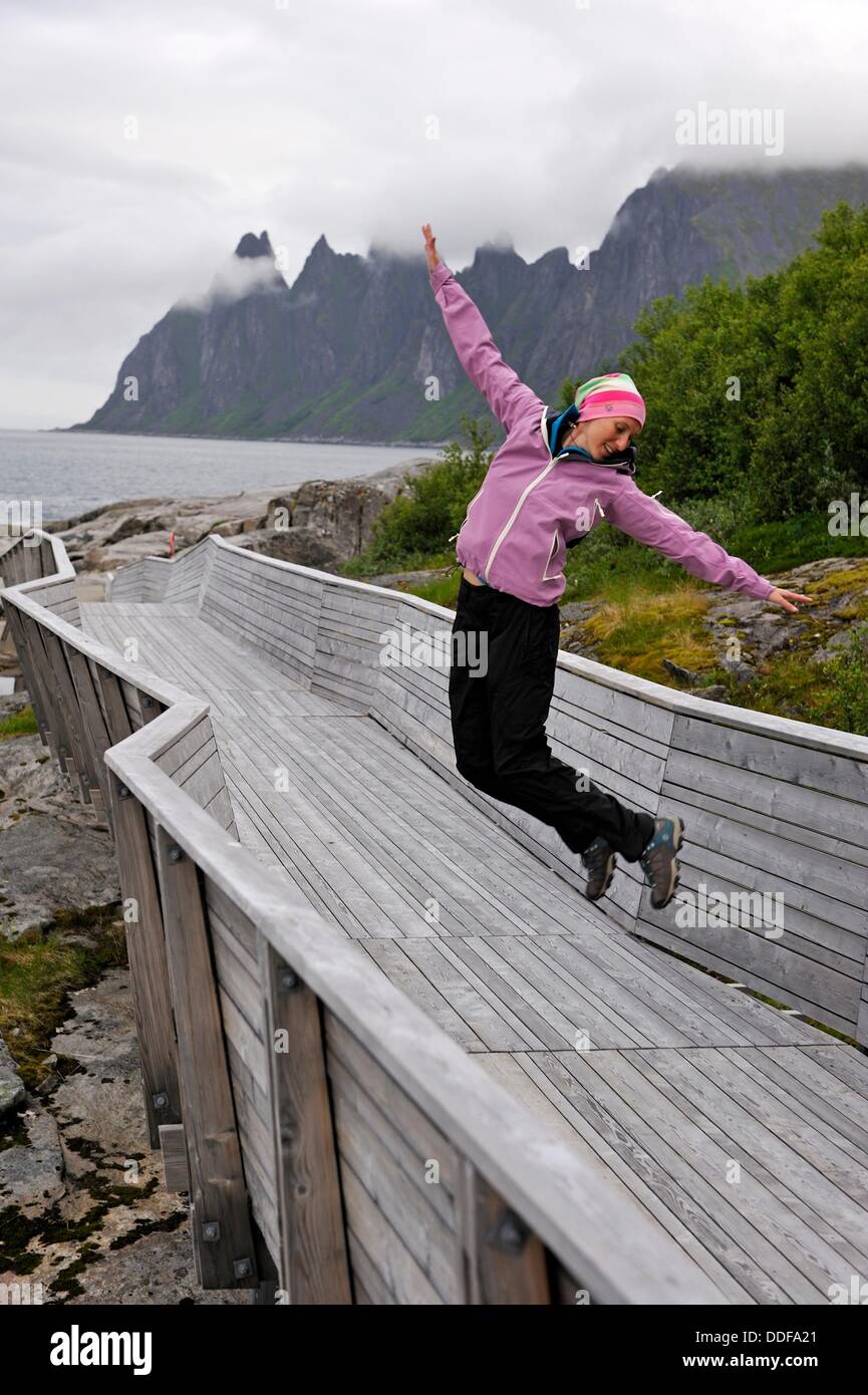 Young woman jumping Landscaping of the National Tourist Route The west ...