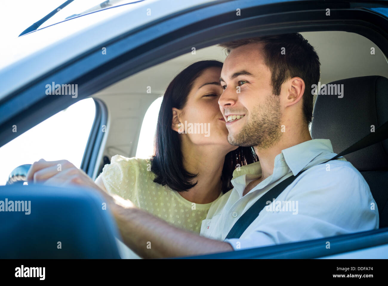 Cheerful couple kissing hi-res stock photography and images - Alamy