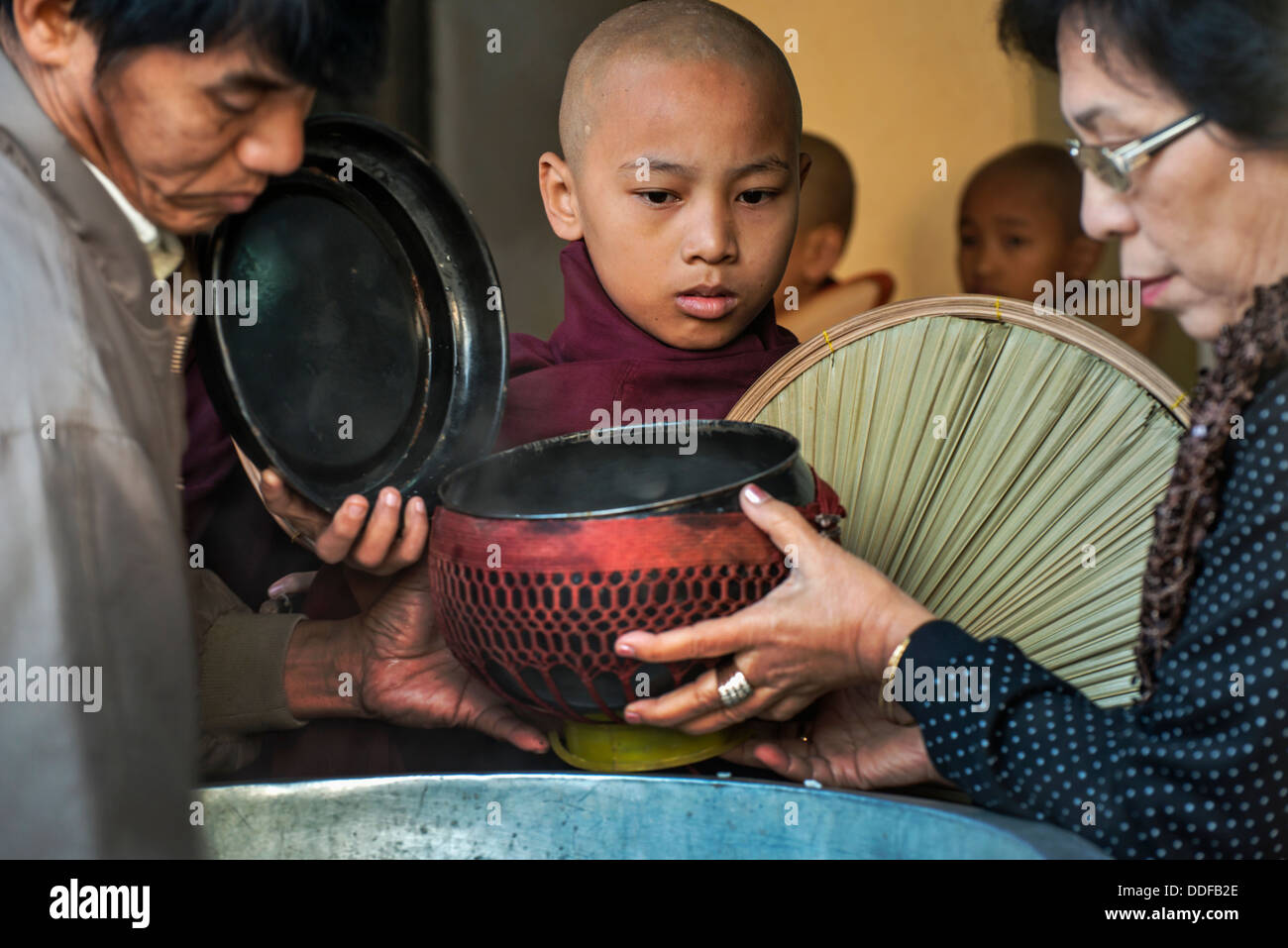 Young monks are offered food Bagan Myanmar Stock Photo - Alamy