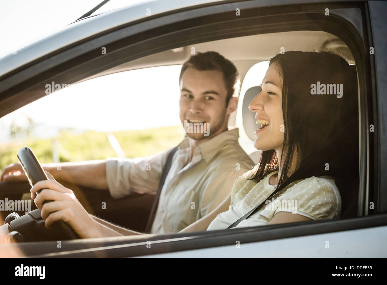 Happy time together - couple in car singing song Stock Photo - Alamy