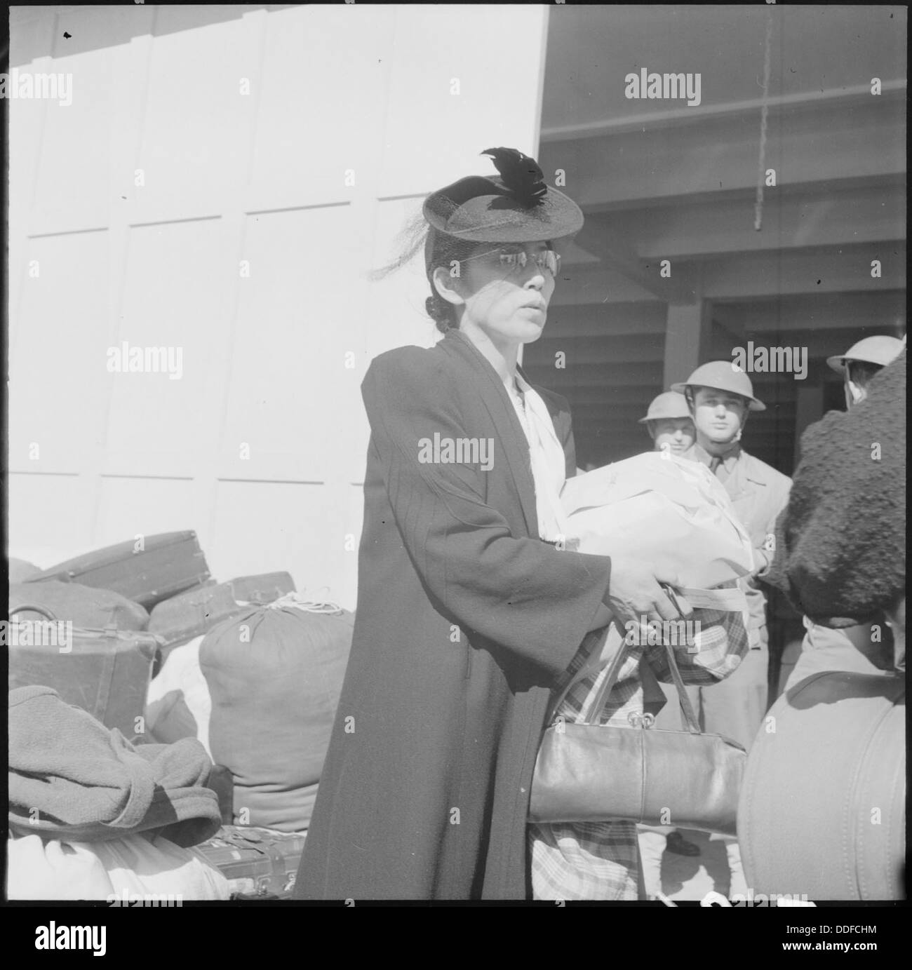 San Francisco, California. An early comer arrives with personal effects ...