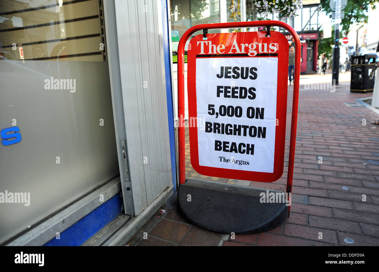 The Argus Brighton newspaper poster board with the headline Jesus Feeds ...