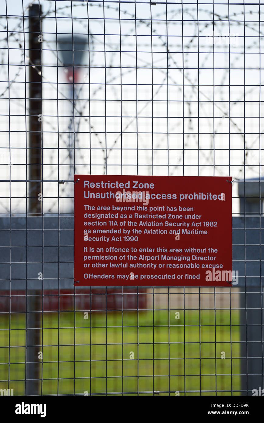 Warning sign on the fence exterior of Heathrow Terminal 5 airport ...