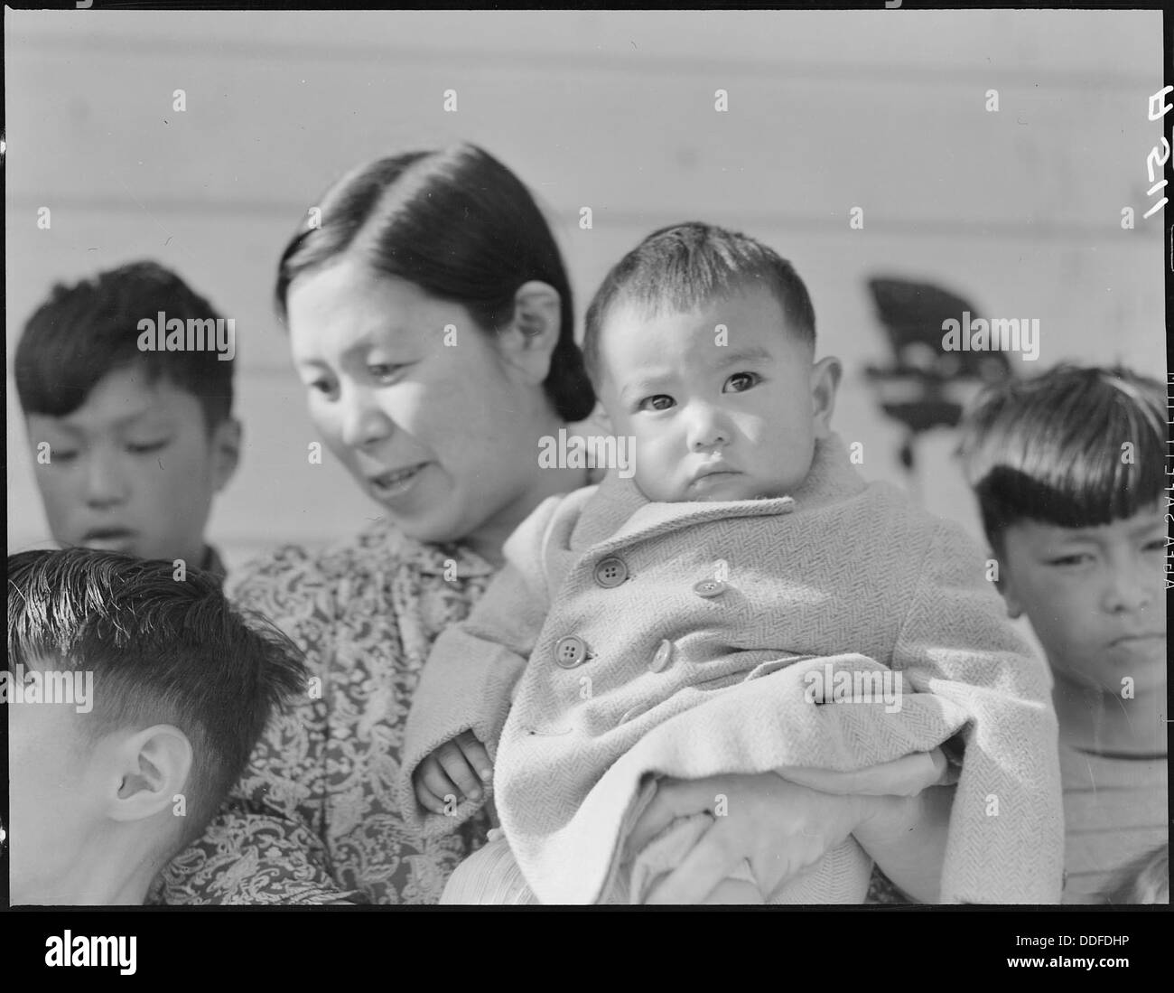 A Japanese mother from San Francisco stands with her youngest child ...