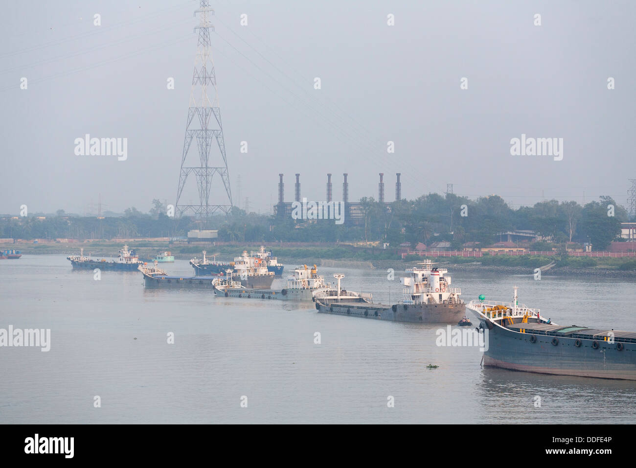 Cargo ships anchored at dusk in the Port of Chittagong on the ...