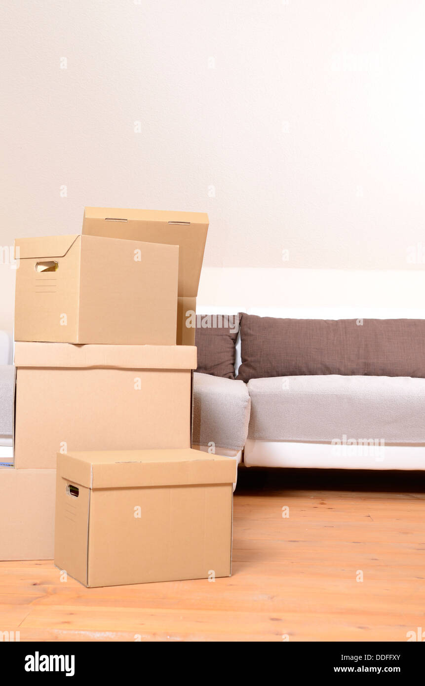 Moving boxes in a new home Stock Photo - Alamy