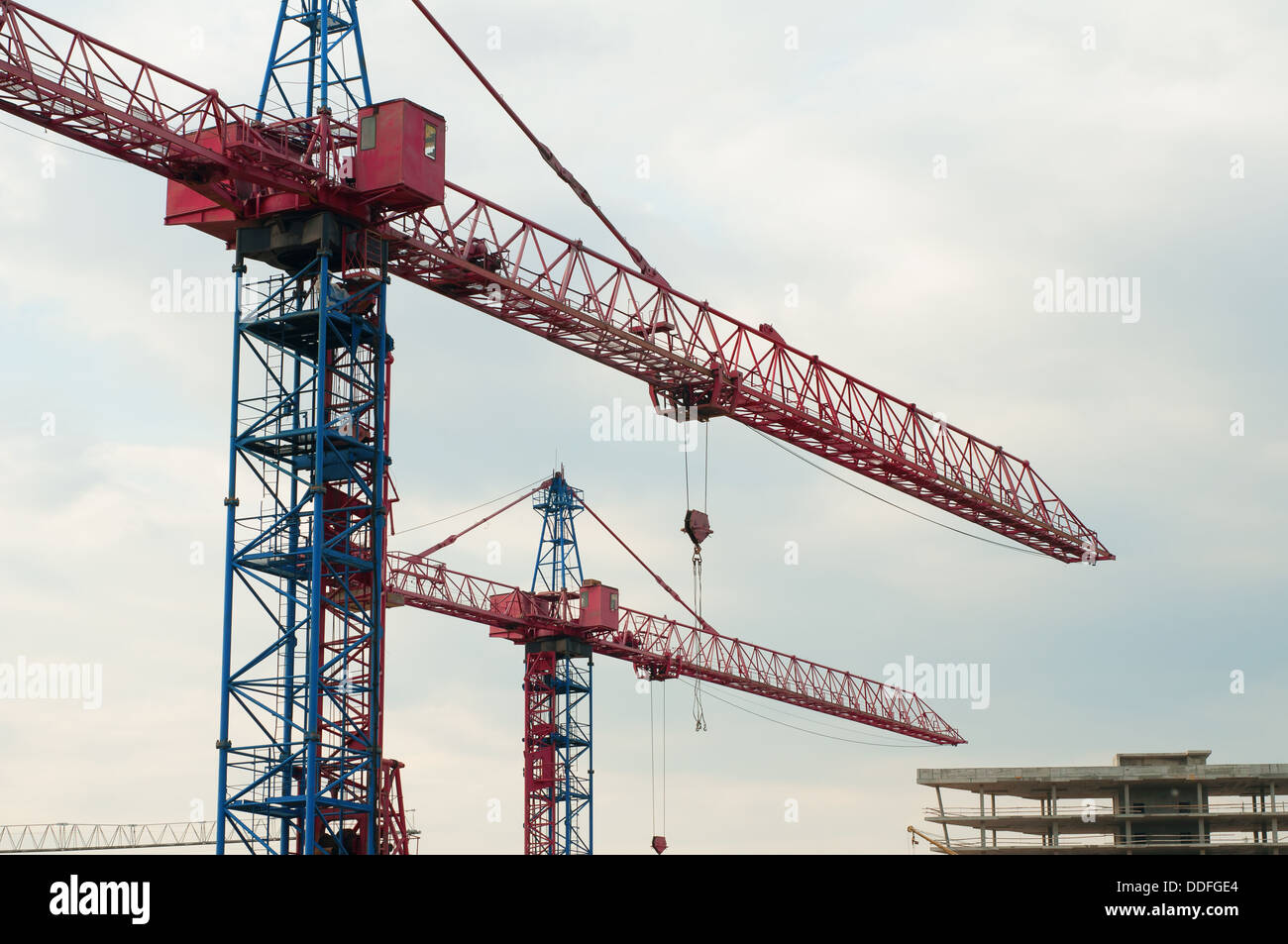 Cranes on construction site Stock Photo - Alamy
