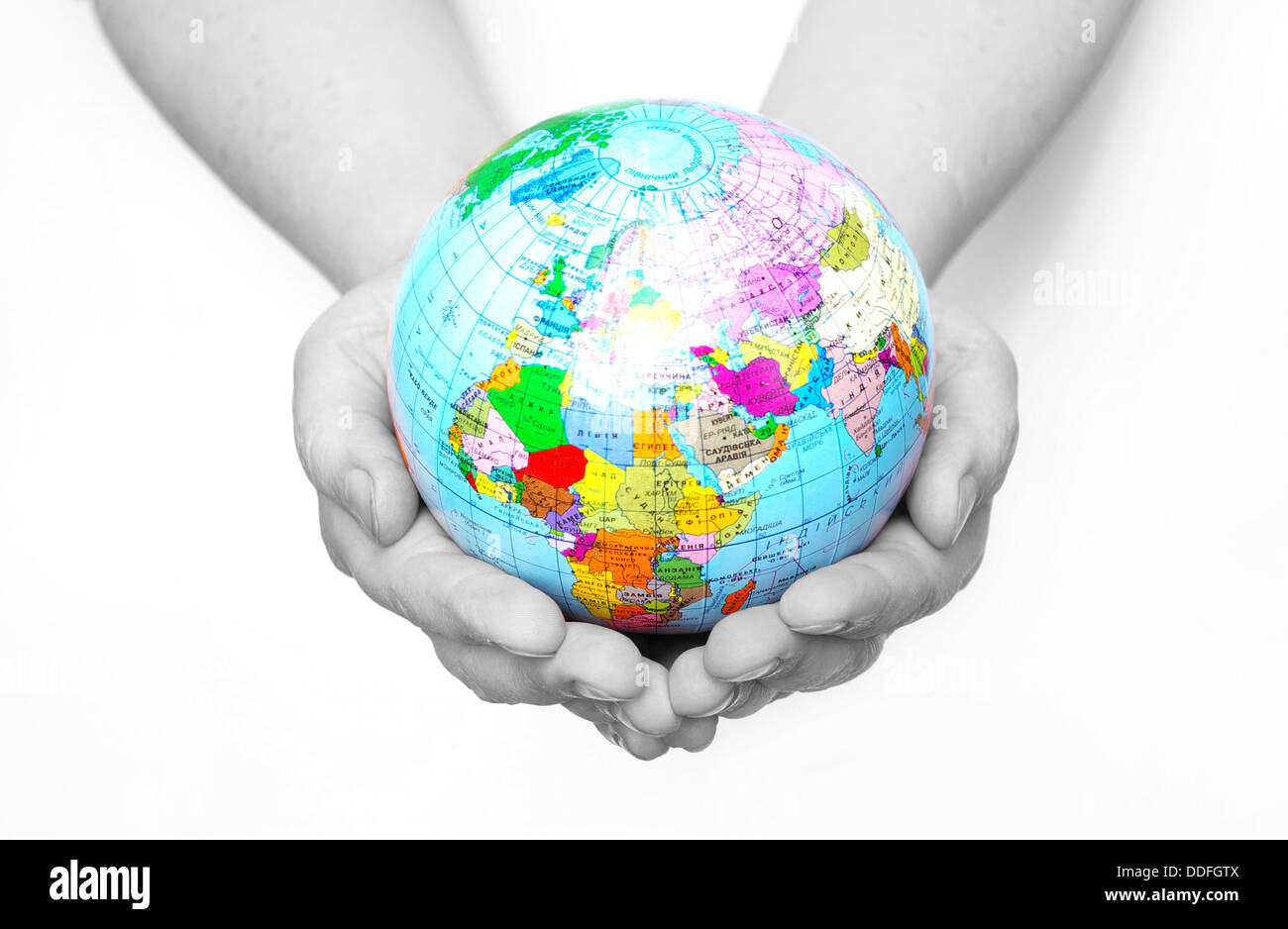 Globe with hands Cut Out Stock Images & Pictures - Alamy