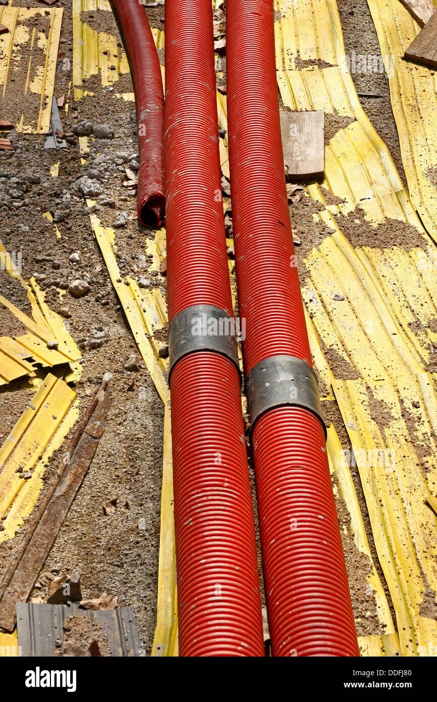 Red pipes, construction material Stock Photo - Alamy