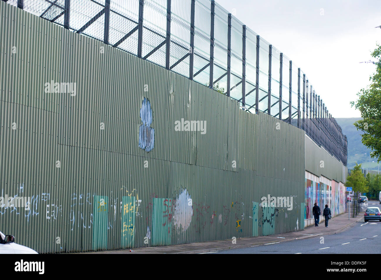 The peace wall in west Belfast keep the catholics and Protestants from ...