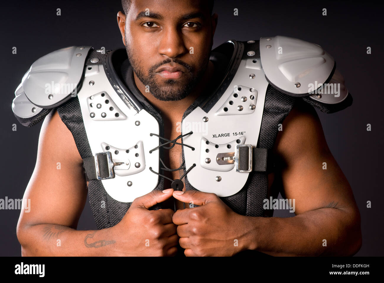 Football Player in Shoulder Pads Stock Photo - Alamy
