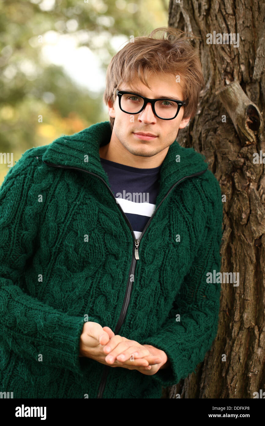 Handsome guy at cold autumn day in the park Stock Photo - Alamy