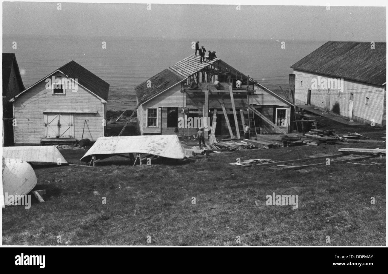 This photograph showcases the buildings and boats of St. George, a ...