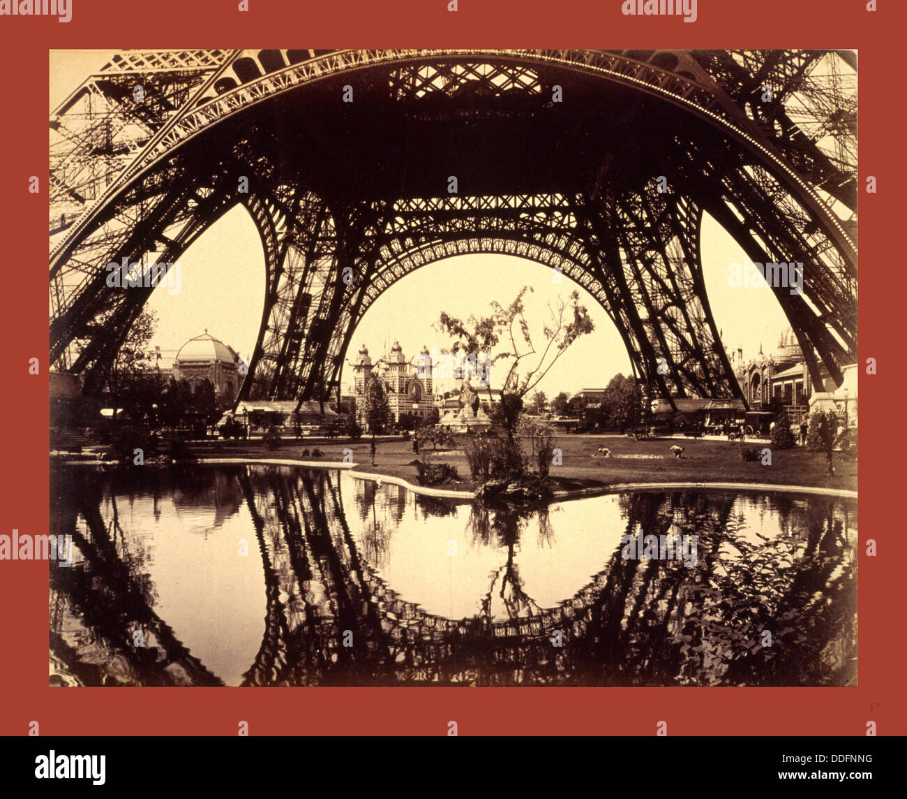 Exhibit buildings and grounds seen through the lower part of the Eiffel ...