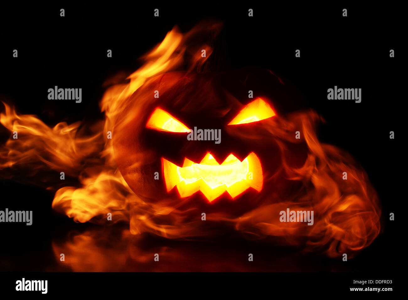 Halloween pumpkin in fire Stock Photo - Alamy