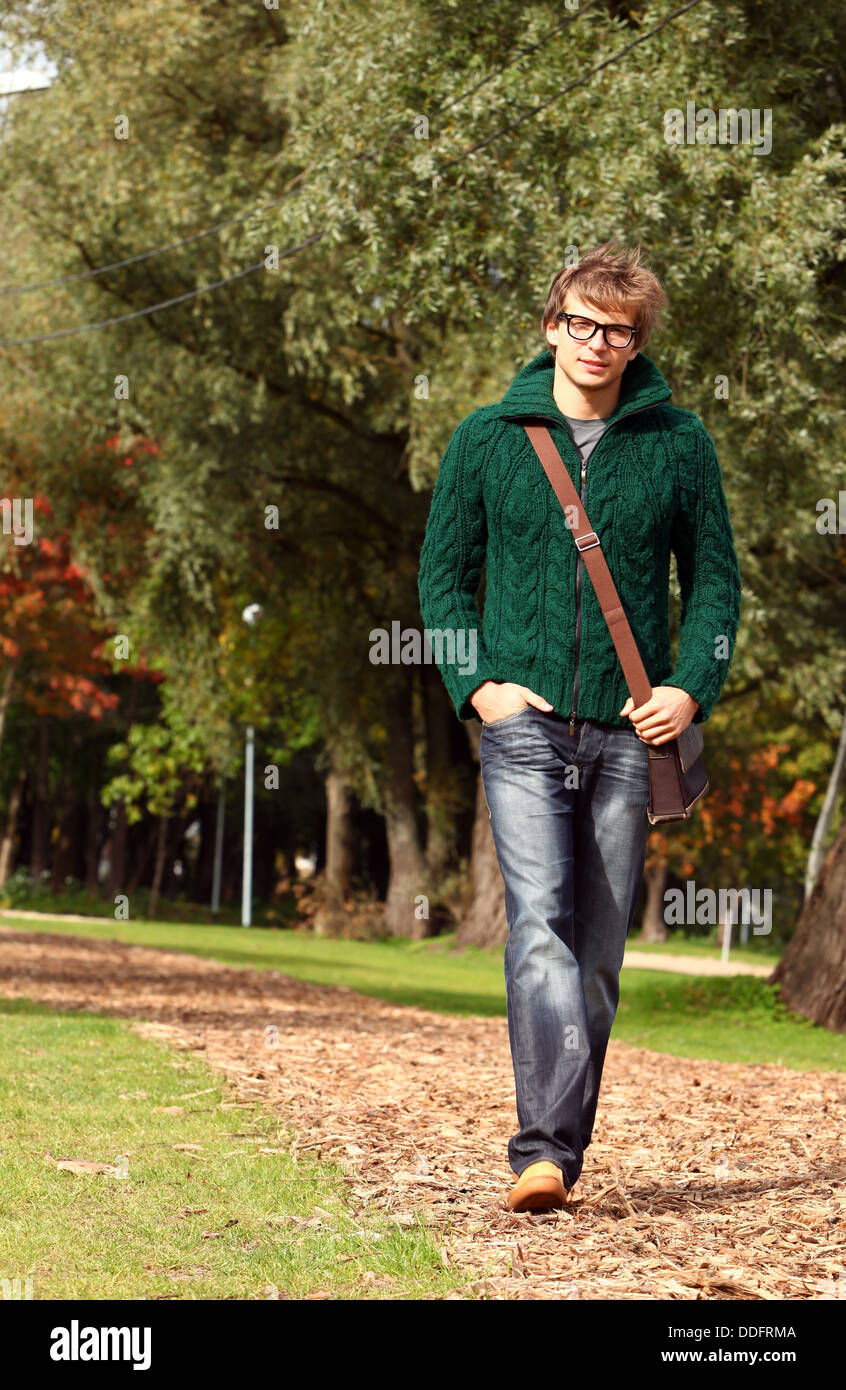 Smart guy walking at cold autumn day Stock Photo - Alamy