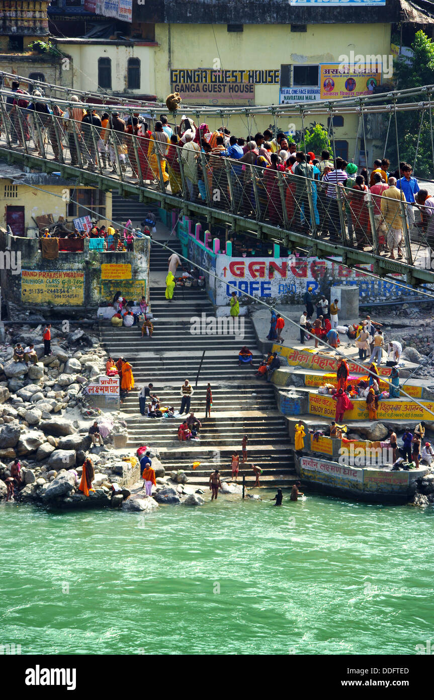 pilgrims crossing the bridge in Rishikesh, India Stock Photo - Alamy