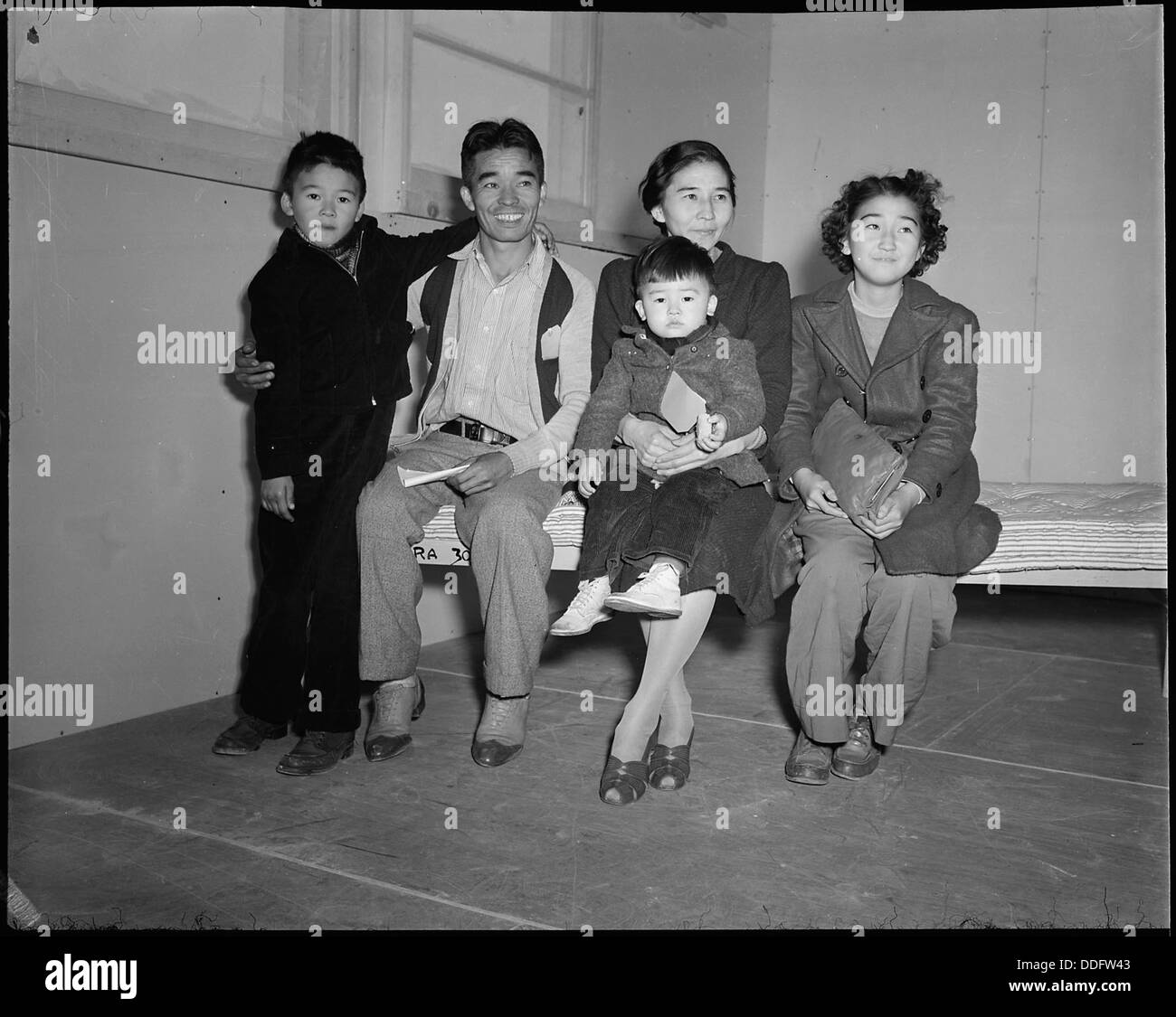 A family of evacuees from Hawaii inspects their new barracks in Topaz ...