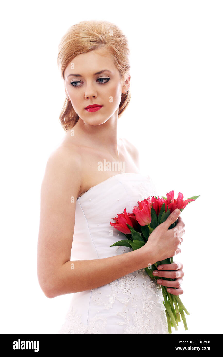 Young bride with red roses Stock Photo - Alamy